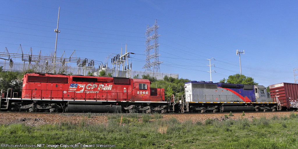CP 5966 and former Alstom demo loco 3072 trail Monday's 277